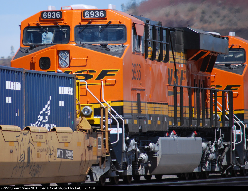 BNSF 6936 and BNSF 6940 Z oom in shot as the Hot Exhaust Flows out off BNSF 6936's GE V-12 ...